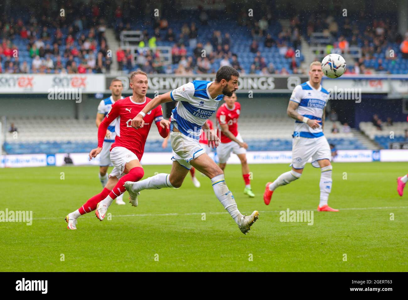 LONDON, UK. AUGUST 21ST QPR's Yoann Barbet heads back to the keeper ...