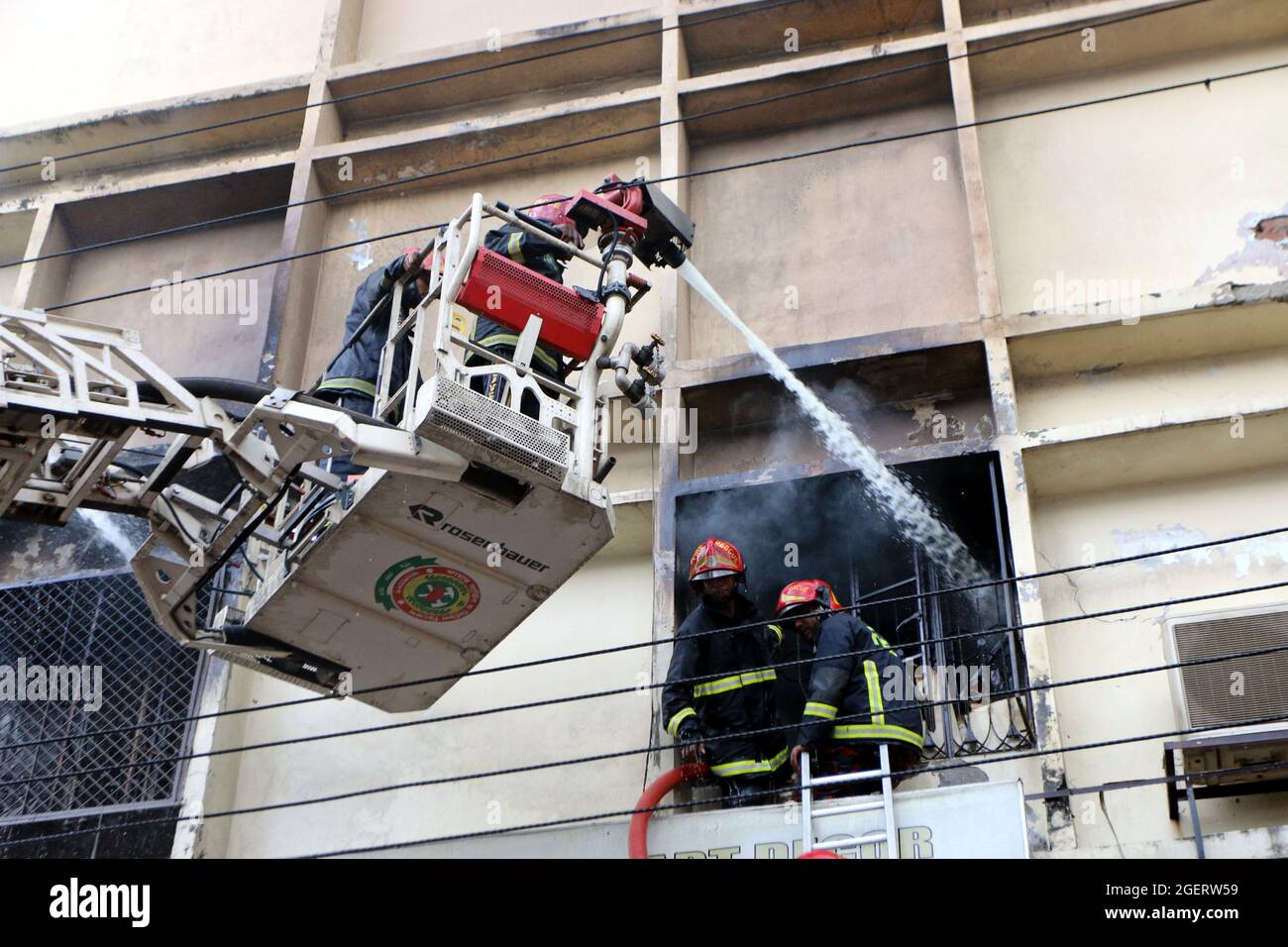 Dhaka, Bangladesh. 21st Aug, 2021. Firefighters fighting a fire that ...