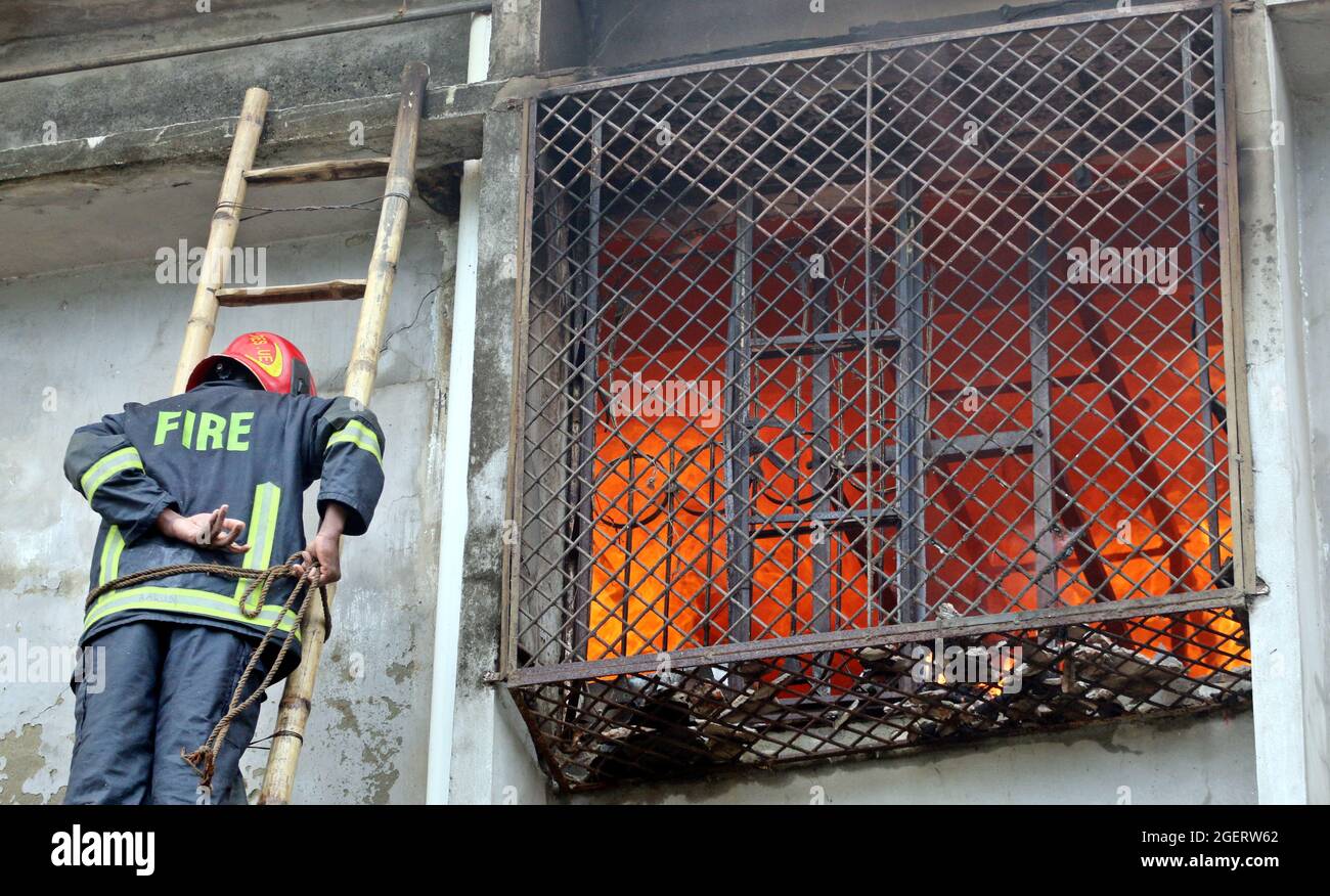 Dhaka, Bangladesh. 21st Aug, 2021. Firefighters fighting a fire that ...