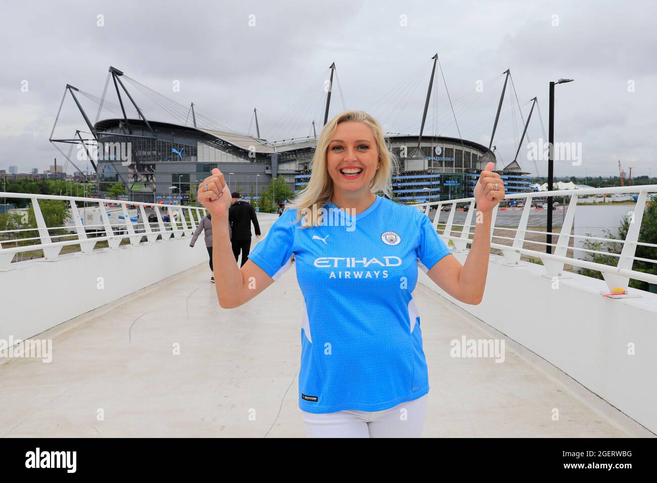 Fans gathering outside the Etihad Stock Photo - Alamy