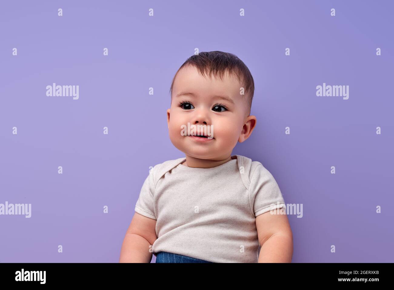 Cute Baby child with sweet cute facial expression posing at camera ...