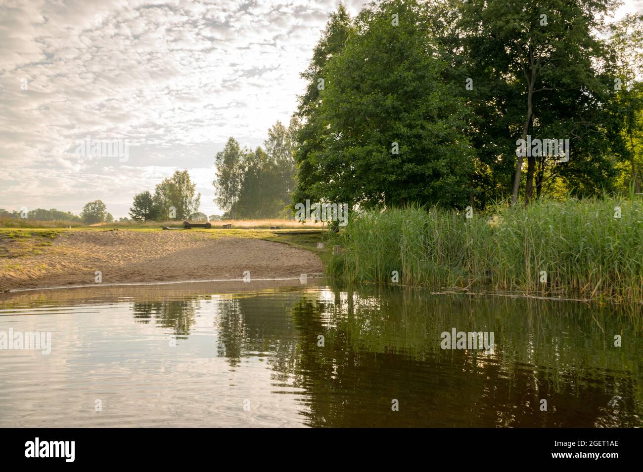 beautiful summer morning landscape on the lake, beautiful clouds and ...