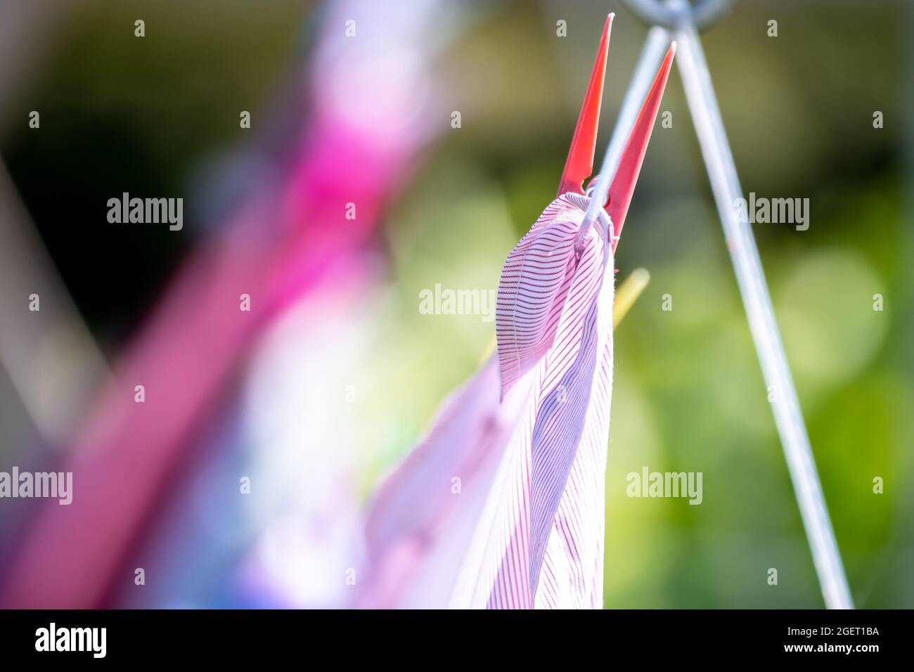 Drying laundry on the clothesline close up outdoors Stock Photo - Alamy