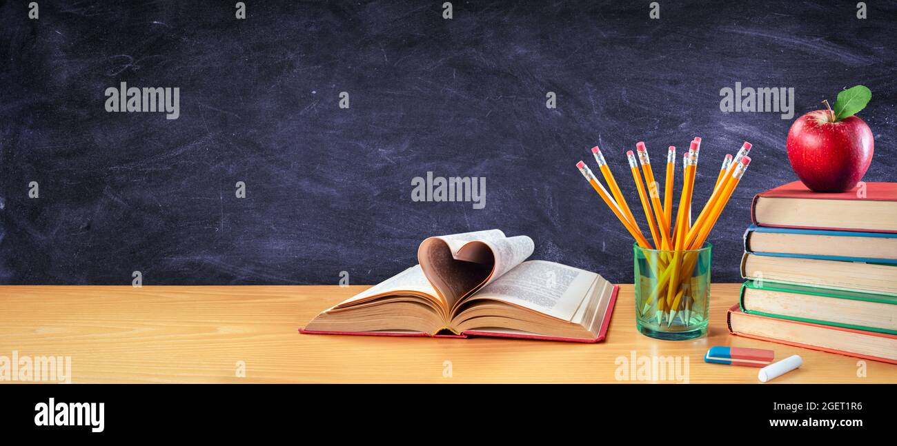 Back To School With Love - Books And Pencils With Apple In Classroom ...