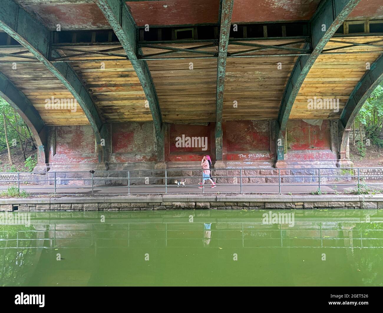 Woman walking water under bridges hi-res stock photography and images ...