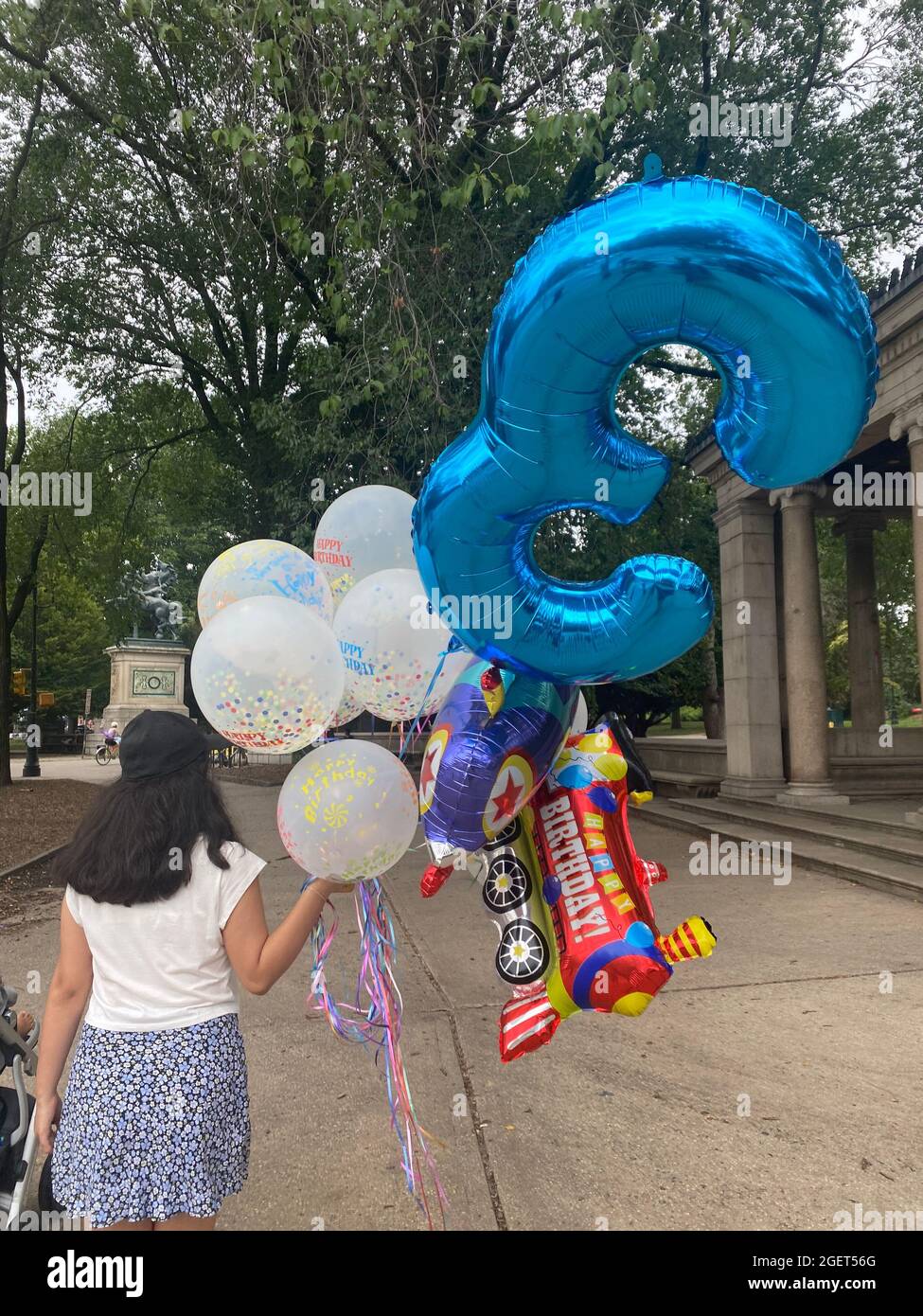 Woman walks into Prospect Park with a bouquet of balloons for what ...