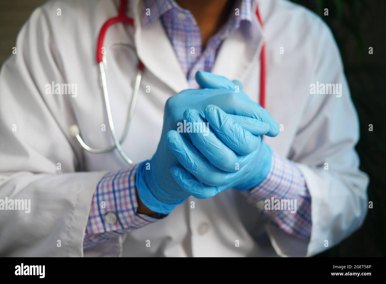 doctor hand with medical gloves showing support sign Stock Photo - Alamy