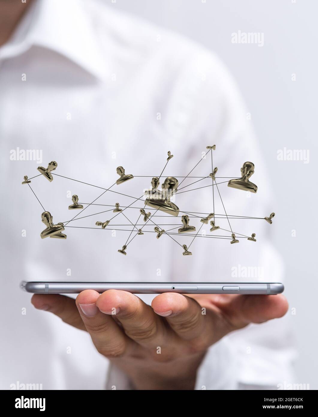 Male's hand pointing to an illustrated sphere network structure ...