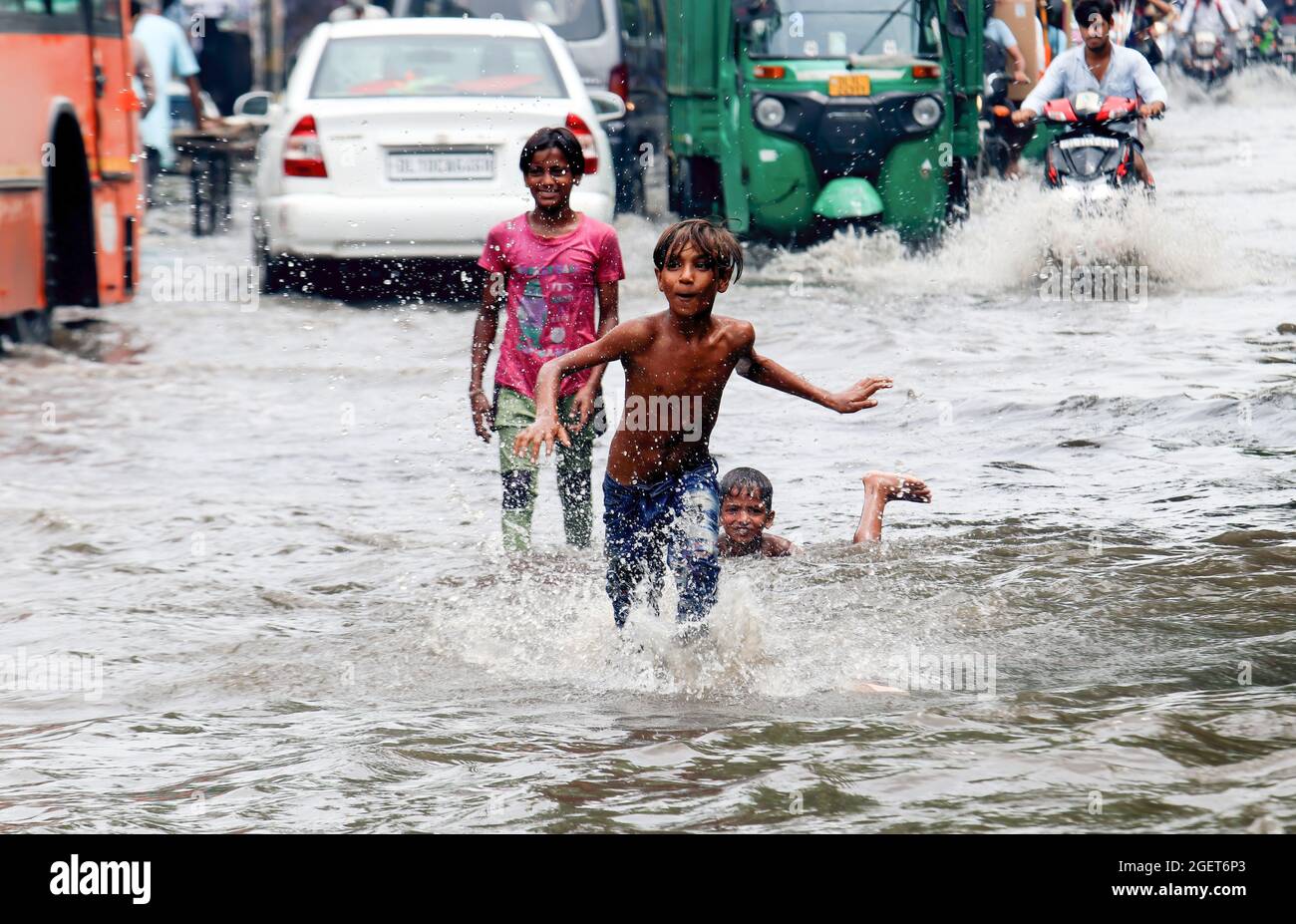Children playing in flood water hi-res stock photography and images - Alamy