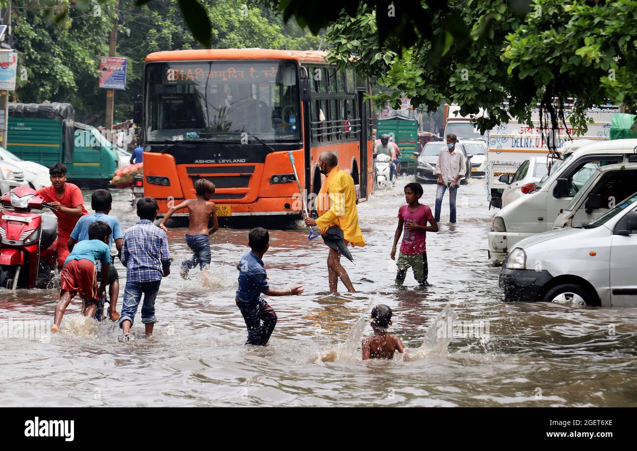 Children playing in flood water hi-res stock photography and images - Alamy