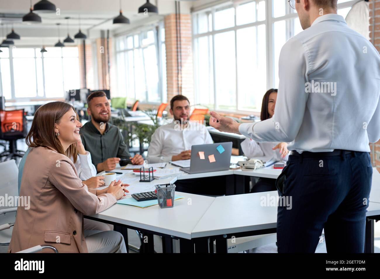 friendly nice business leader manager having talk, giving speech to ...