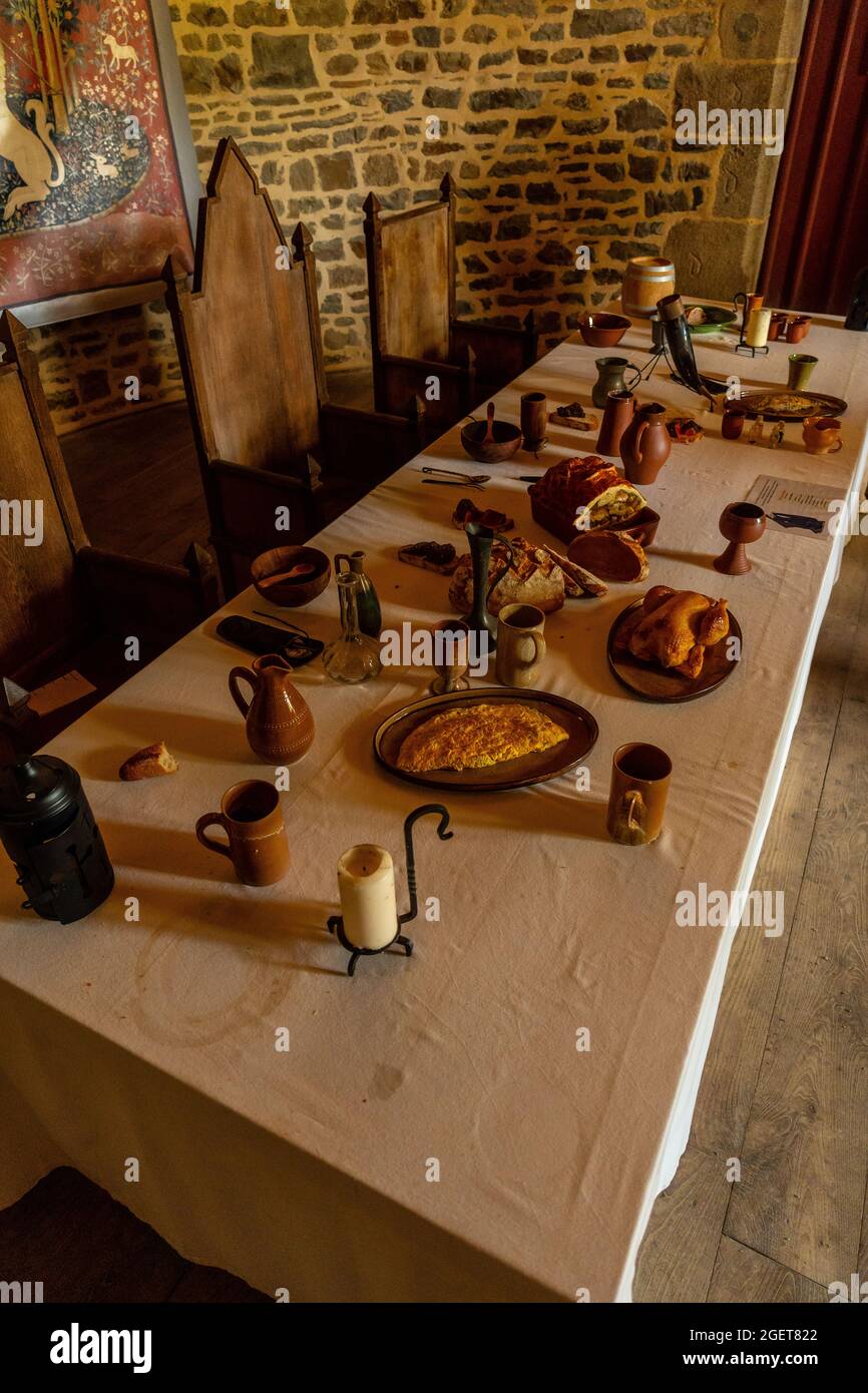 Vertical shot of medieval kings' banquet in the dining room at the ...