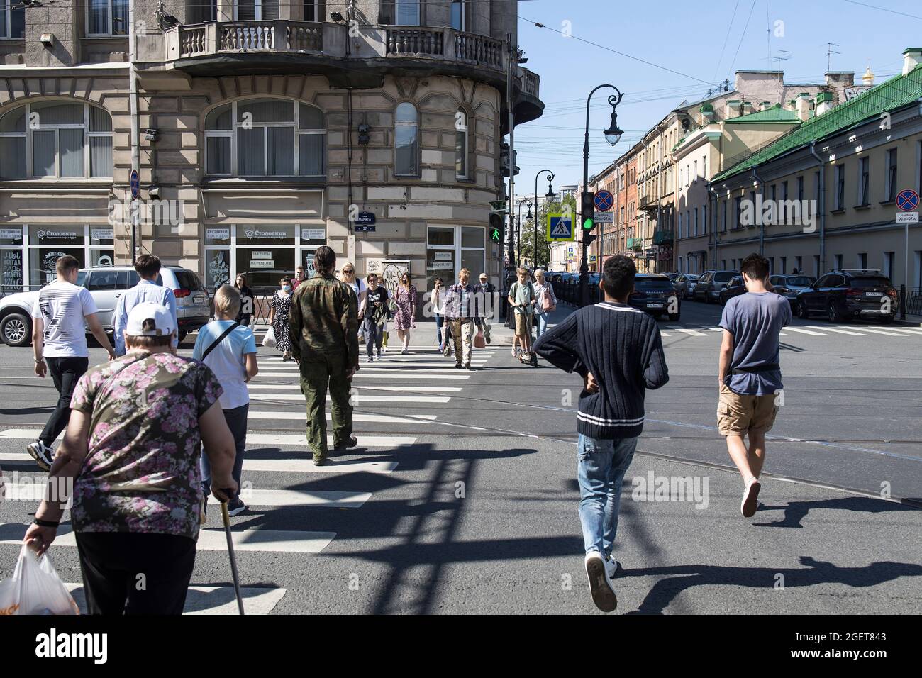 Saint Petersburg, Russia - 9 August 2021, People cross the road on a ...