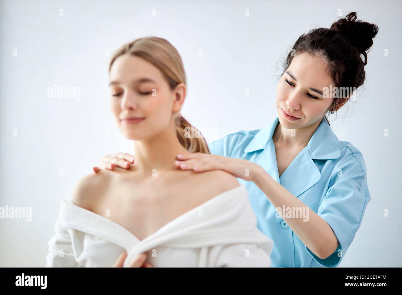 Charming Lady Getting Neck Massage In Beauty Spa. Caucasian Female ...