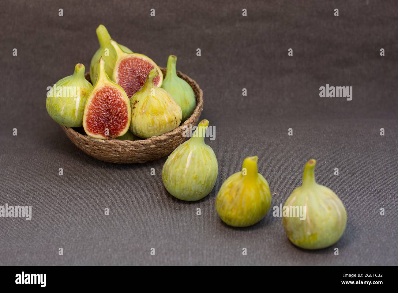 split fresh figs in basket Stock Photo - Alamy