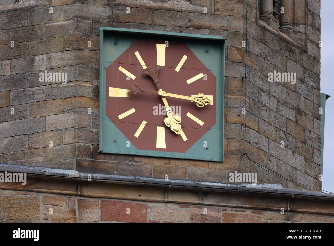 Clock with a gilded dial on the church Stock Photo - Alamy