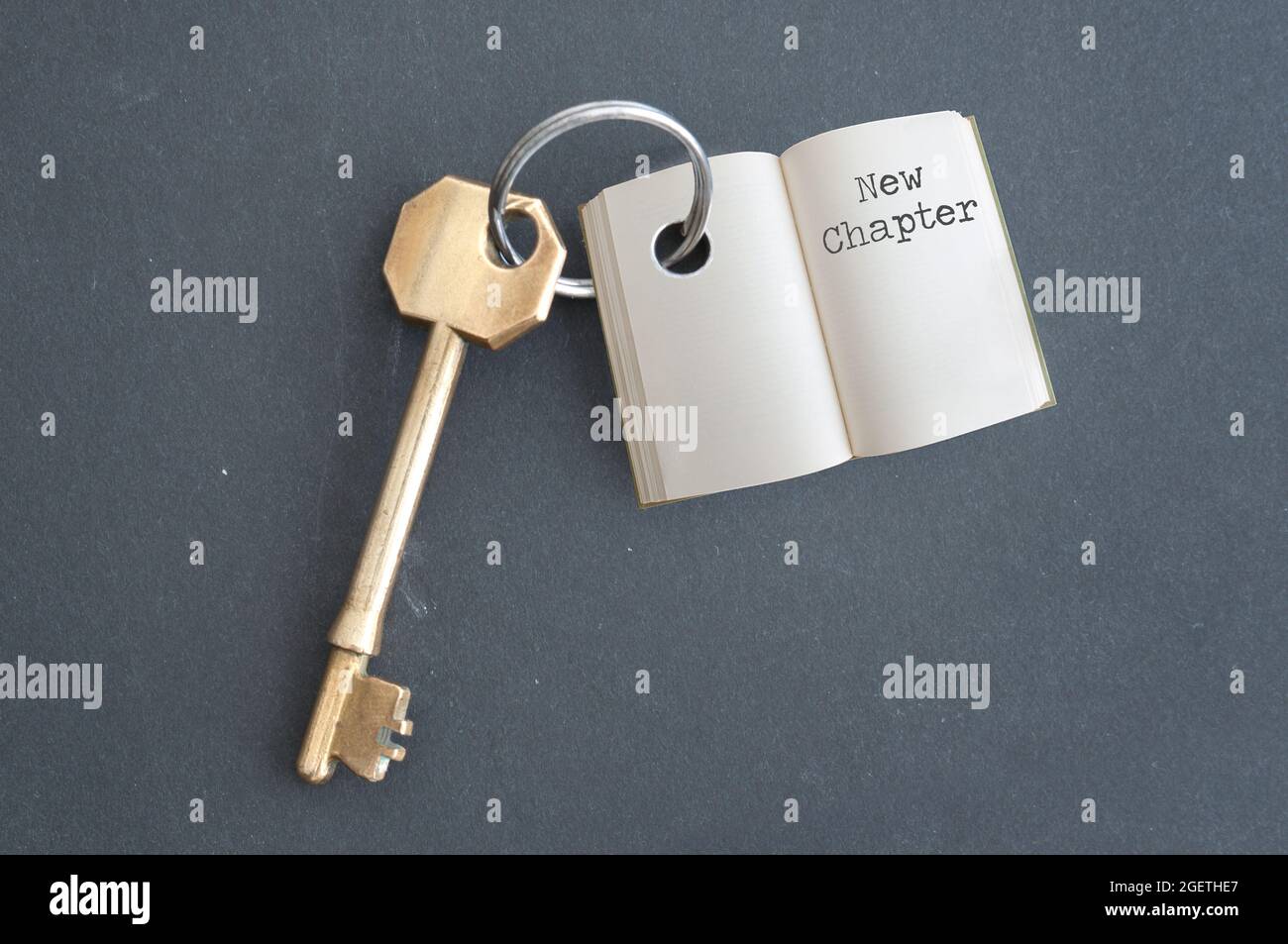 Keyring with open book and chapter one on a chalkboard Stock Photo - Alamy