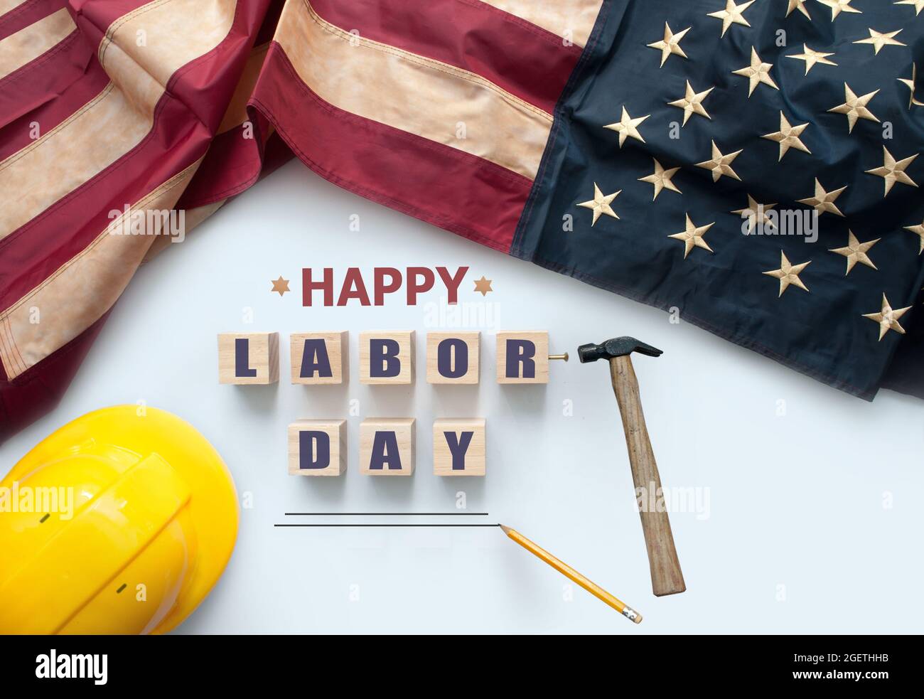 Happy labor day printed on wooden blocks with vintage American flag and ...