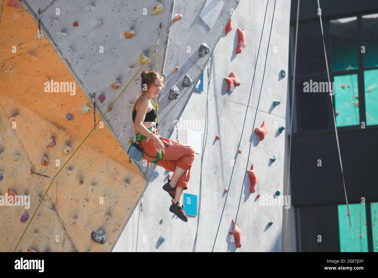 bouldering, girl climbing up the wall Stock Photo - Alamy