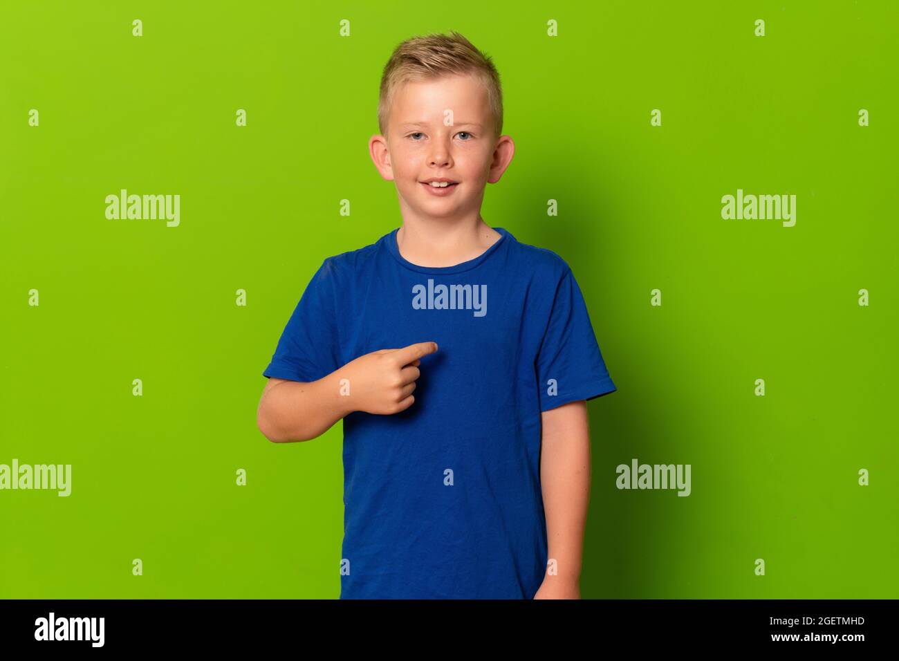 little boy proud of himself isolated over green background Stock Photo ...