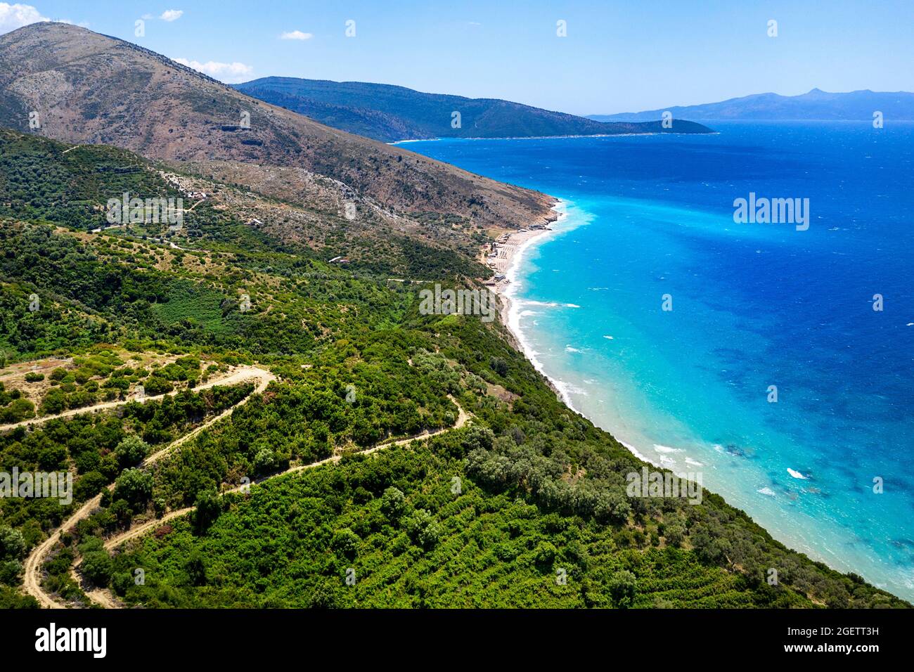 Aerial view of beautiful sandy beach with olive trees on the Albanian ...
