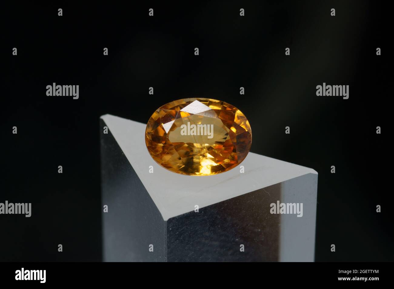 Natural gemstone yellow citrine on a black background Stock Photo - Alamy