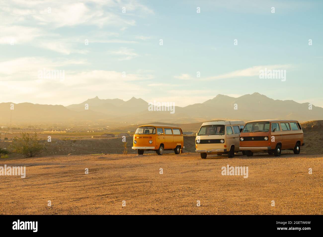 row of classic Volkswagen Kombi bus campers in the desert near Kingman ...