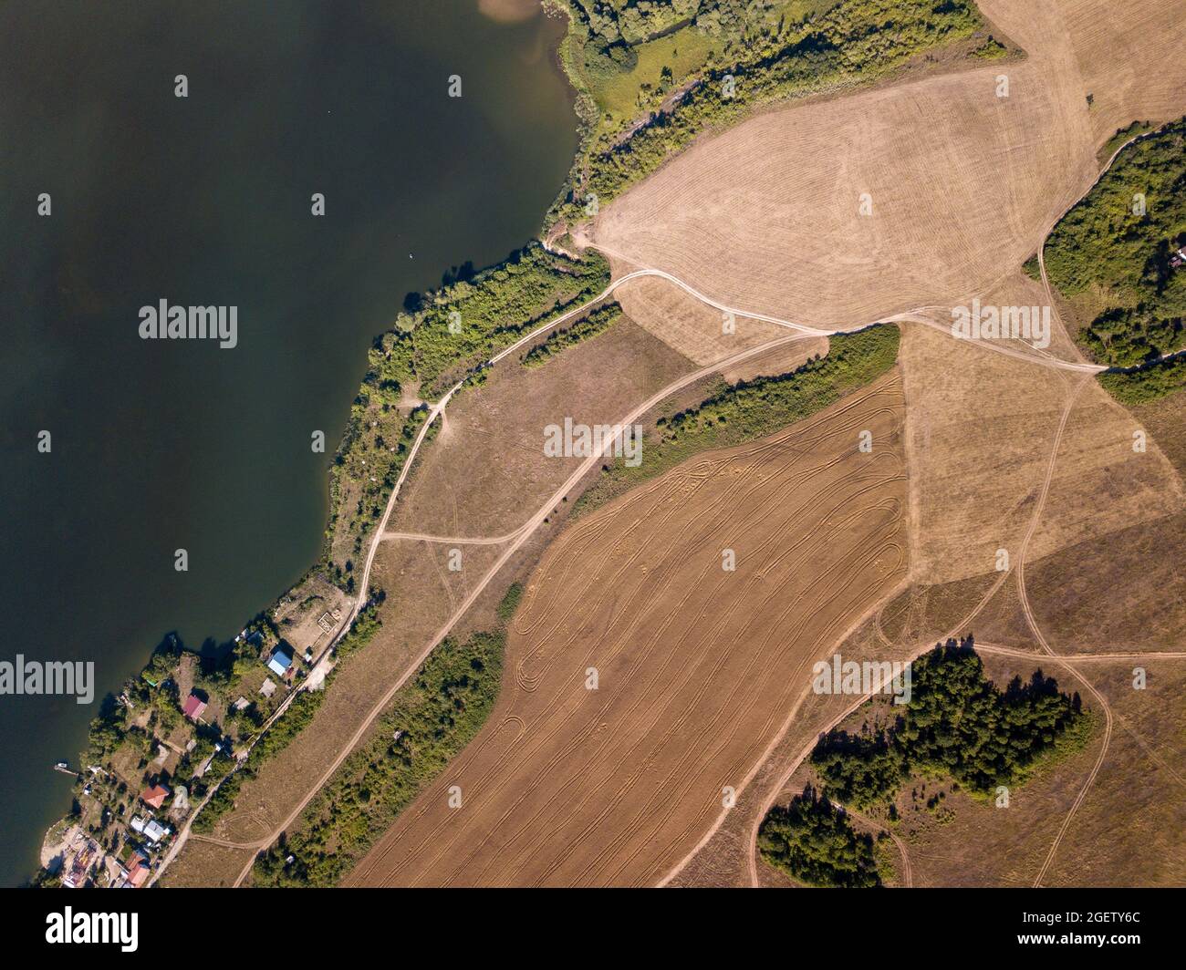 Top view of a landscape covered in lush valleys and a blue ocean Stock ...
