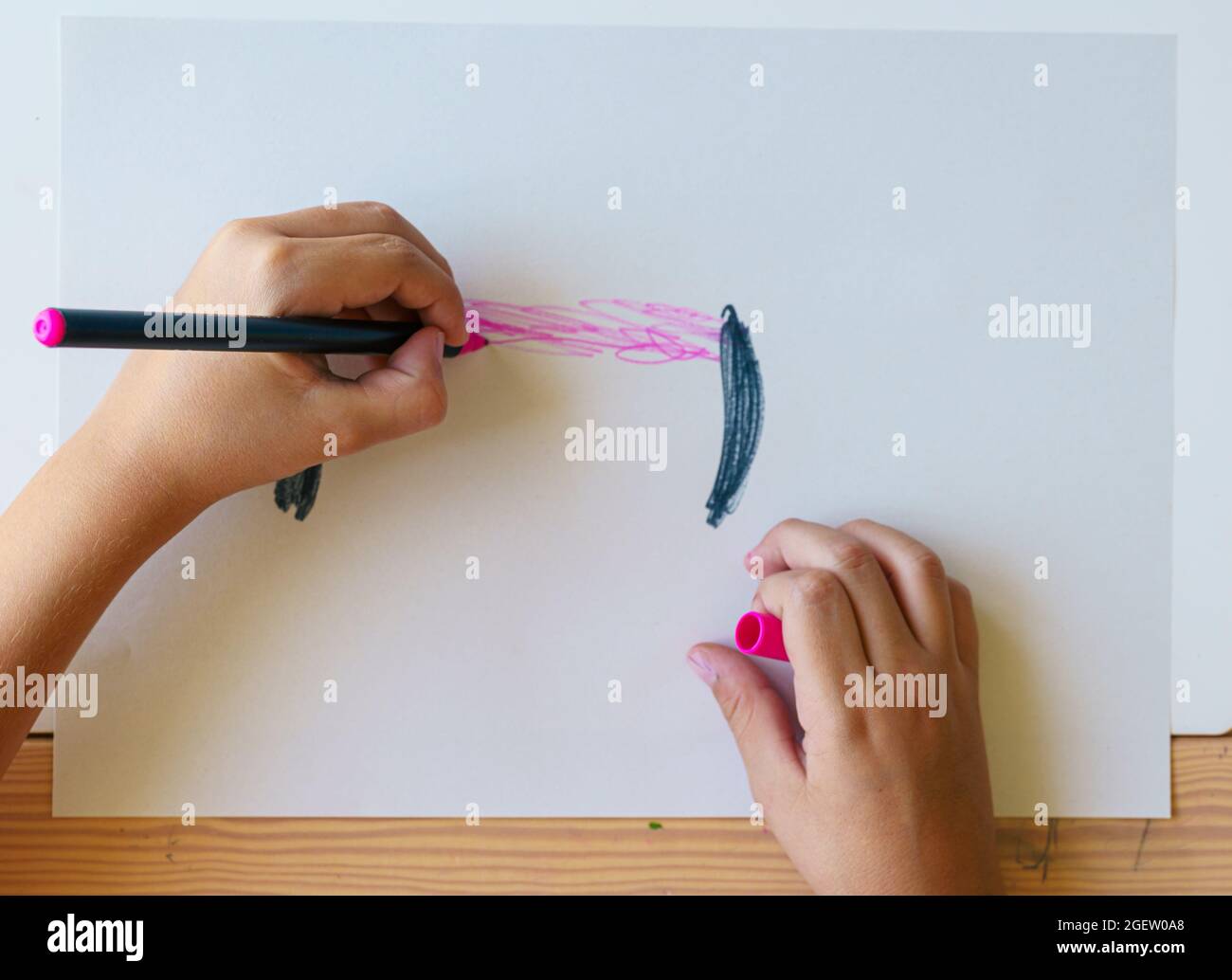 Children hand with marker drawing on a paper Stock Photo - Alamy