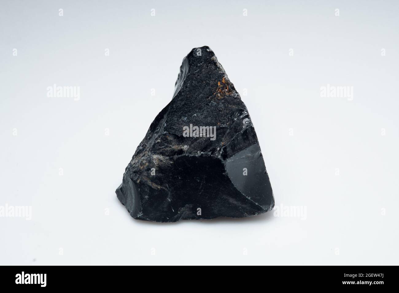 Natural black obsidian stone on background Stock Photo - Alamy