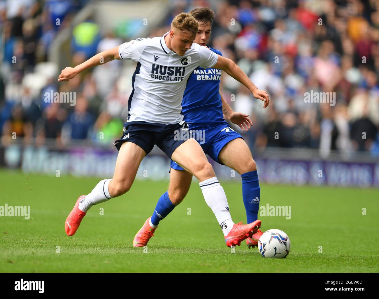 Millwall's Daniel Ballard (left) and Cardiff City's Mark Harris battle ...
