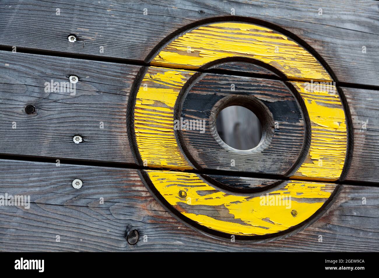 wooden target with holes in the middle Stock Photo - Alamy