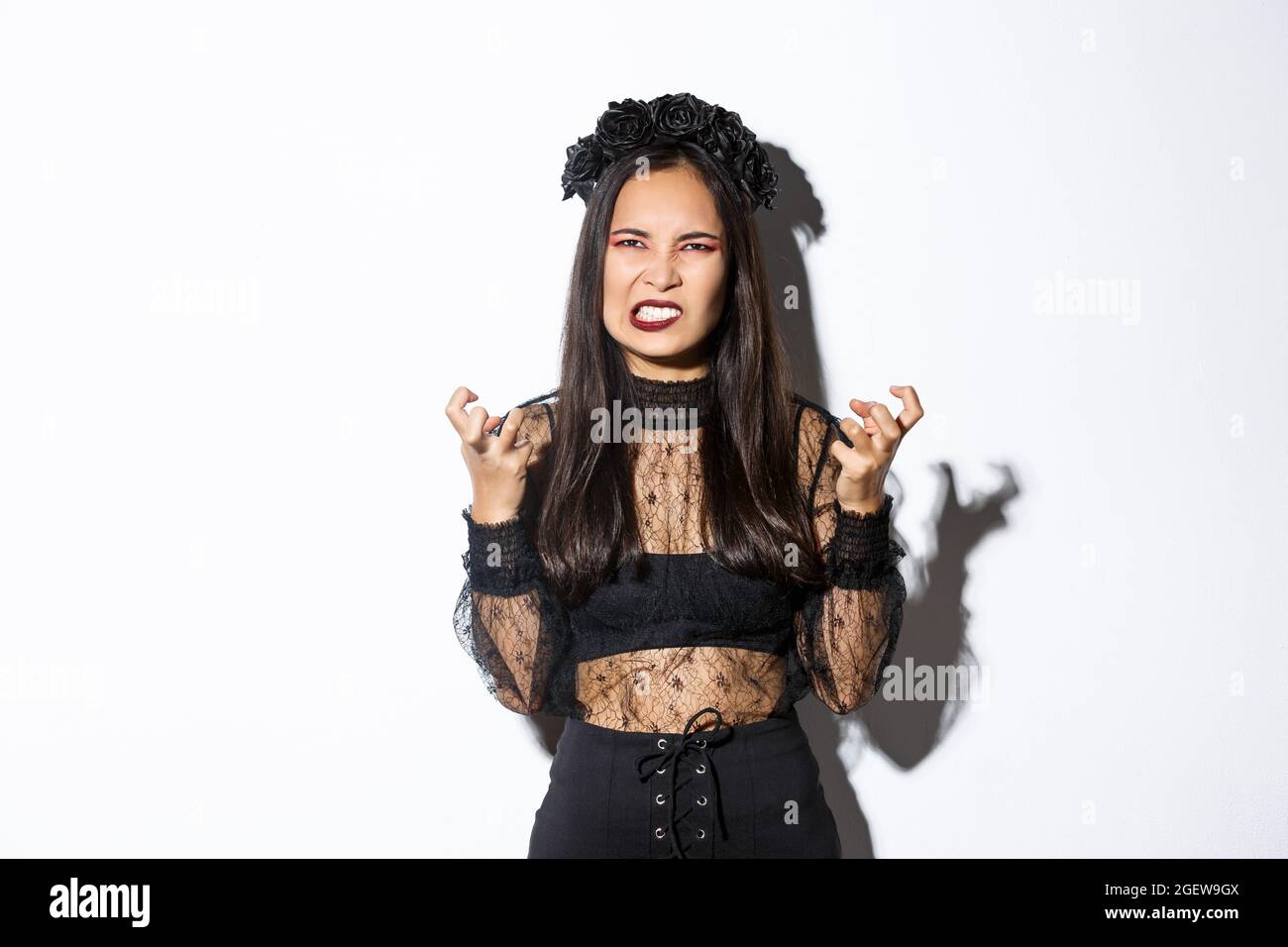 Image of angry wicked witch cursing and swearing, clenching fists and ...