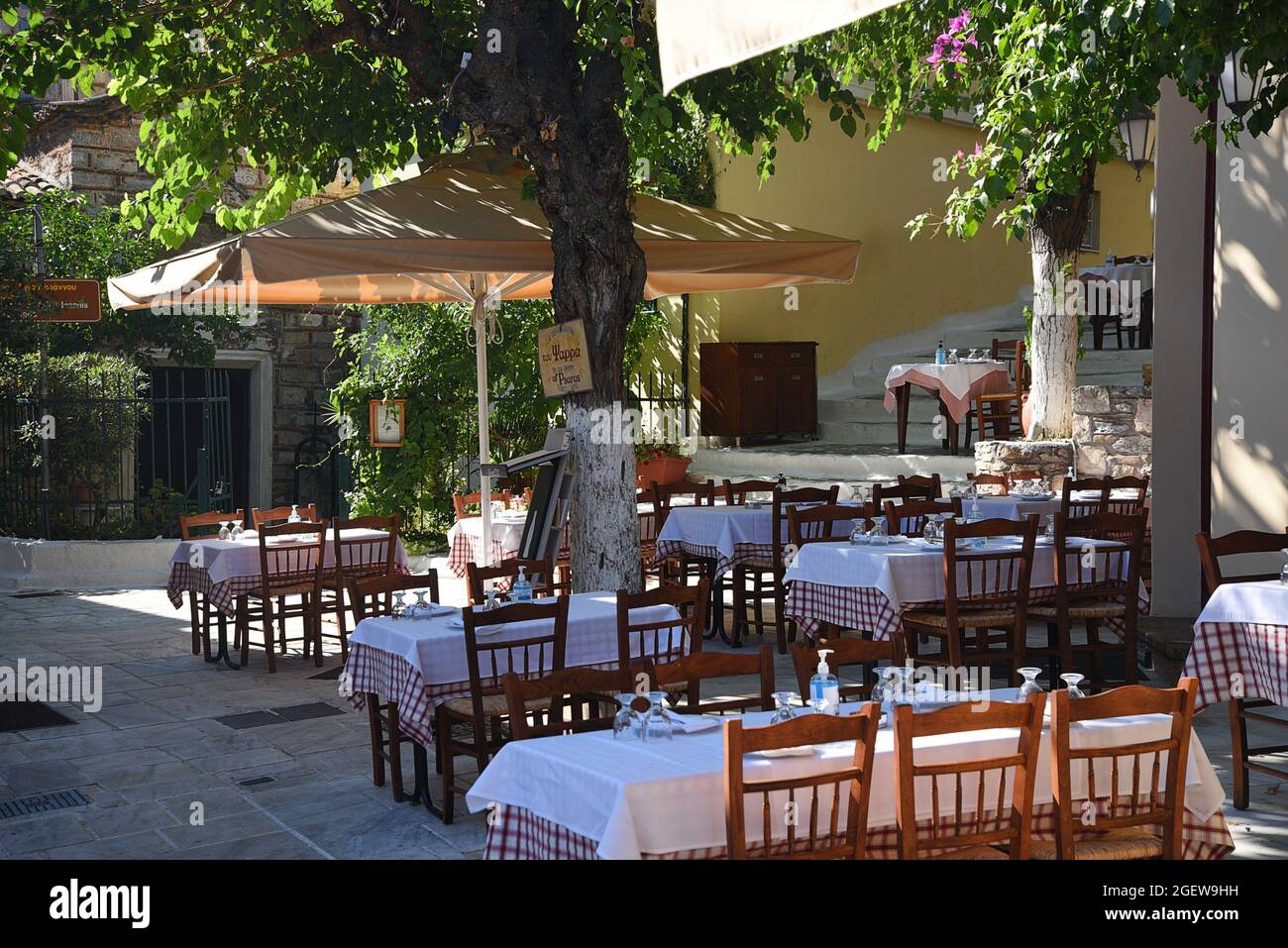 Traditional Greek taverna patio in the picturesque neighborhood of ...