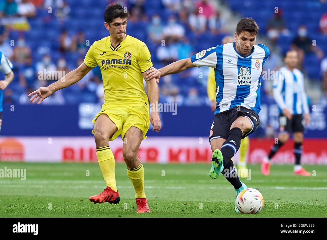 Gerard Moreno of Villarreal CF in action with Leandro Cabrera of RCD ...