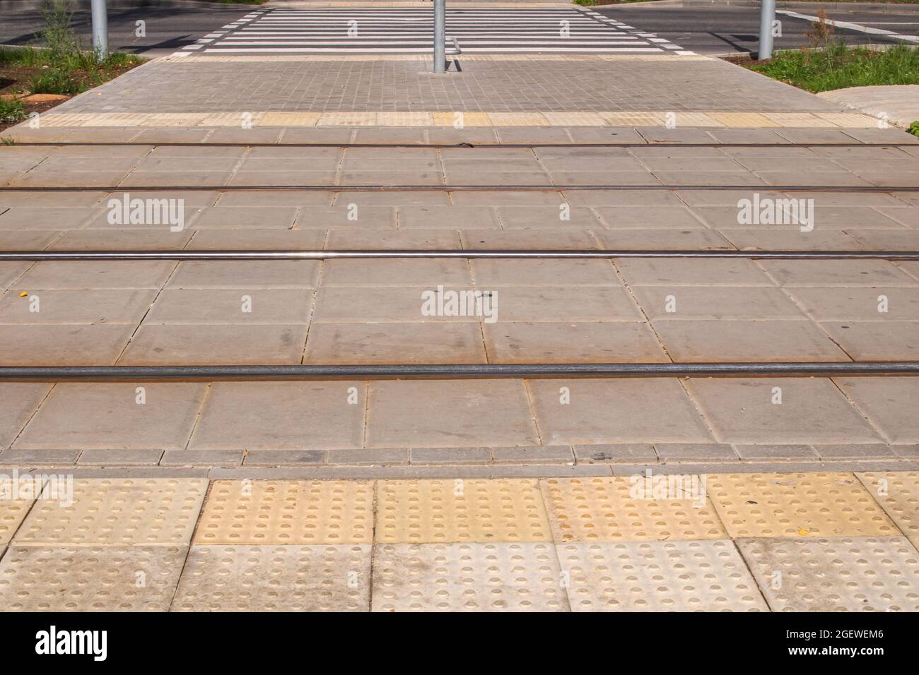 Pedestrian crossing on tram tracks close up, background Stock Photo - Alamy