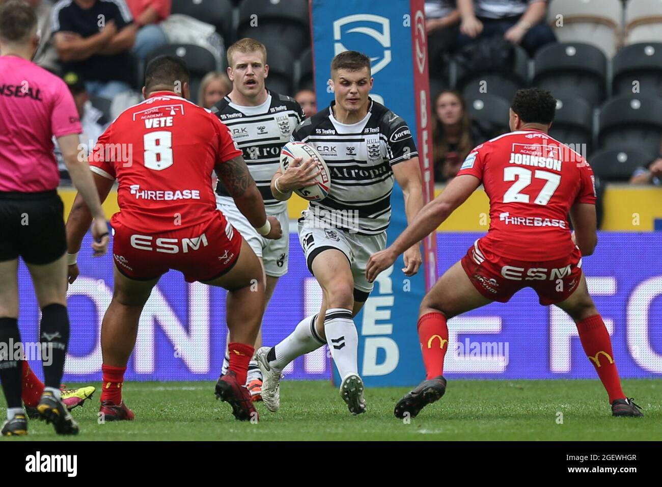 Cameron Scott (24) of Hull FC runs at Luis Johnson (27) of Hull KR ...