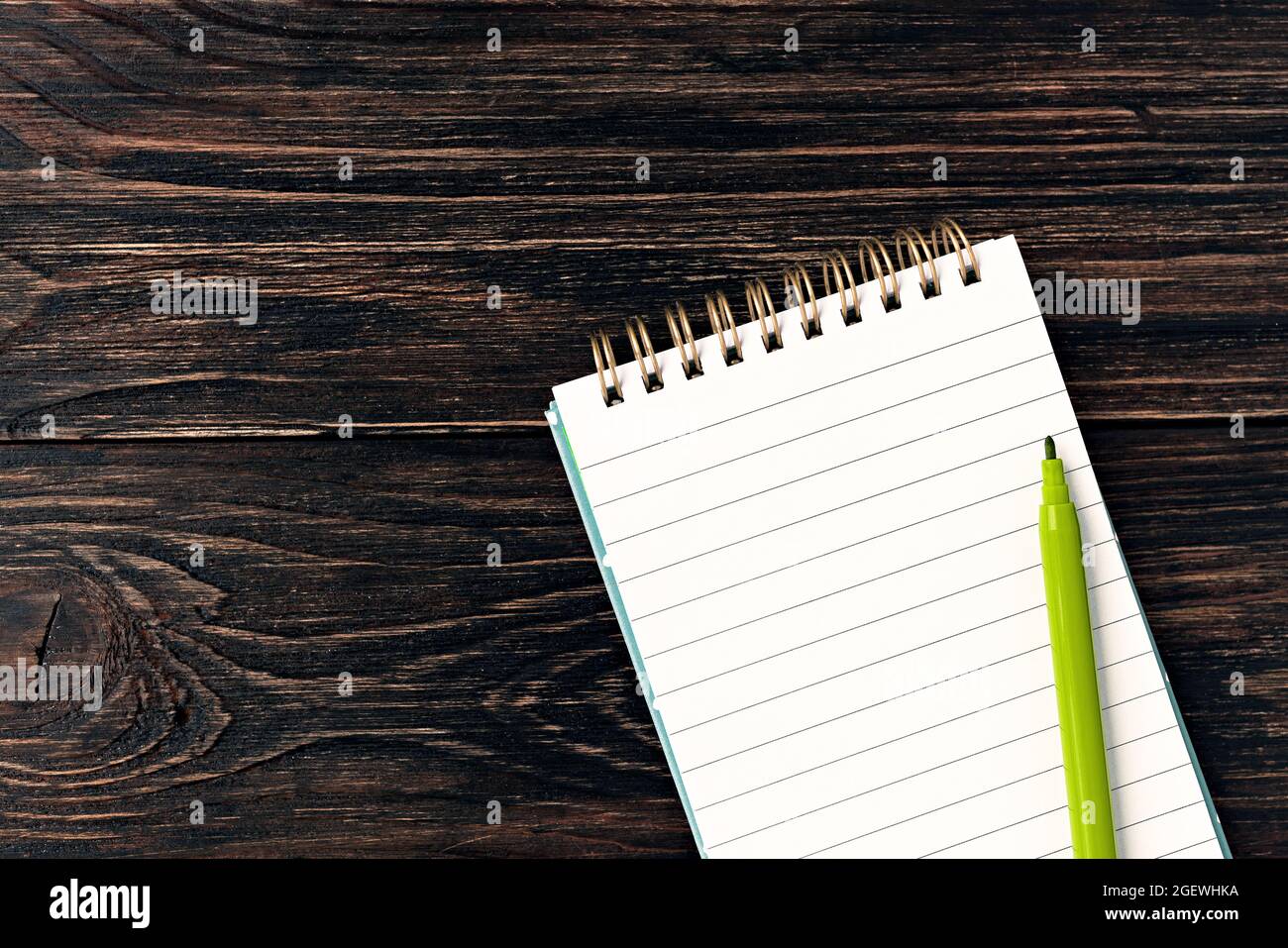 template for text and design. empty white notepad and one marker on old ...