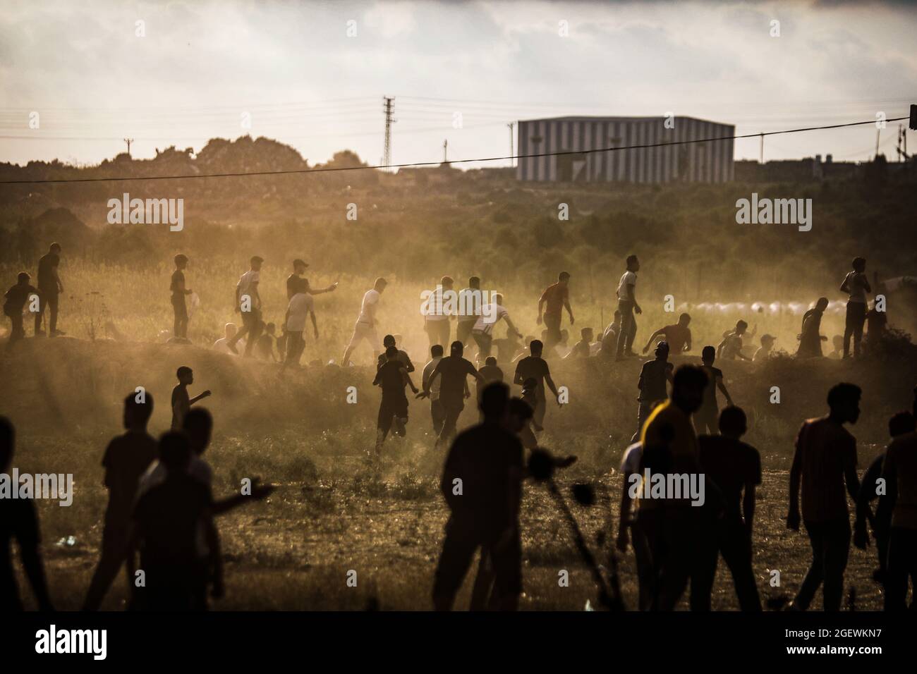 Palestinian protesters take part in a demonstration at the border fence ...