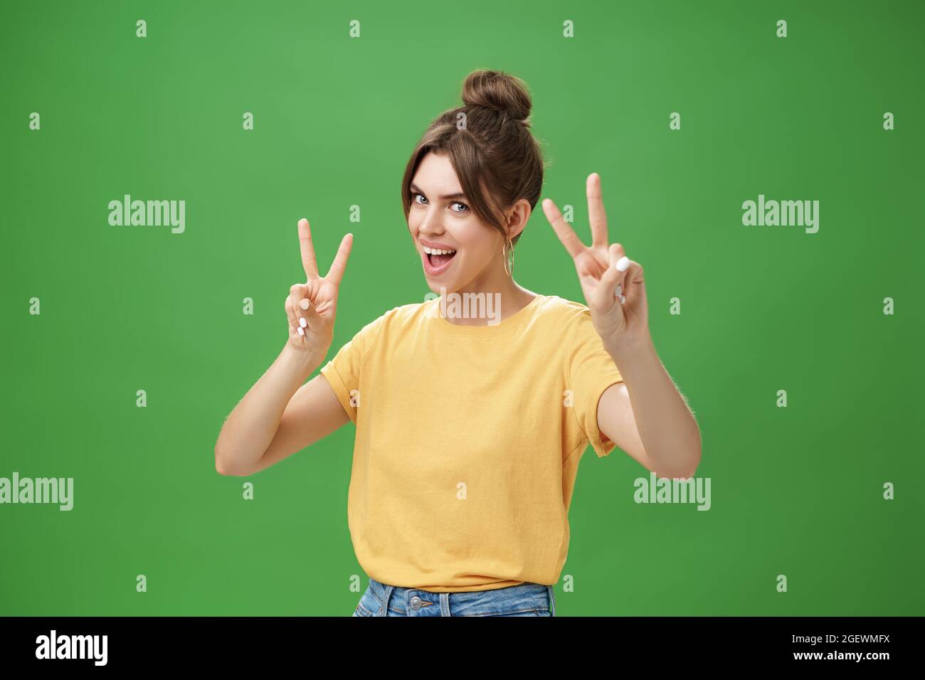 Indoor shot of enthusiastic excited and happy daring girl with combed ...