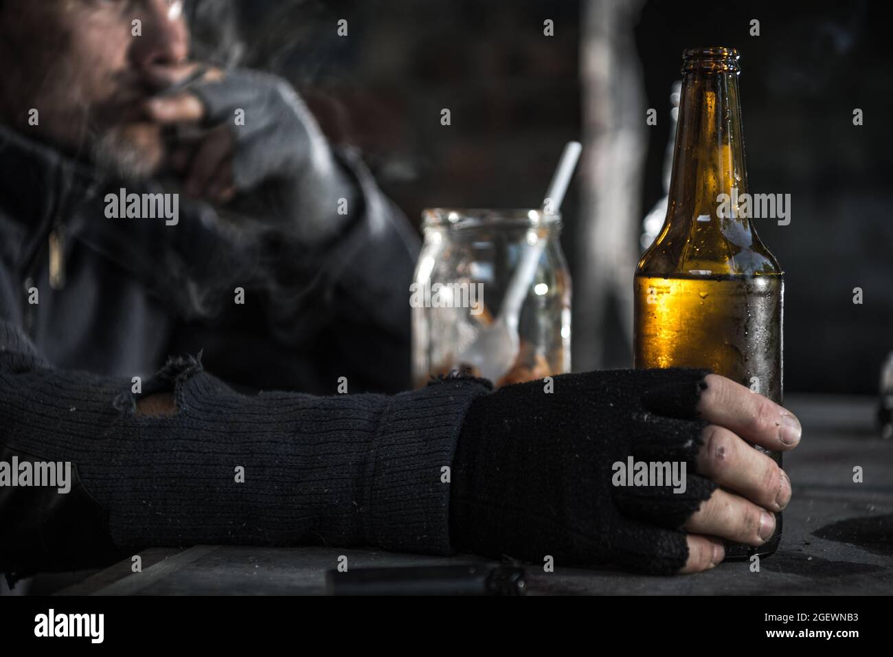 Homeless Alcoholic Drinking Another Bottle of Bear and Smoking ...