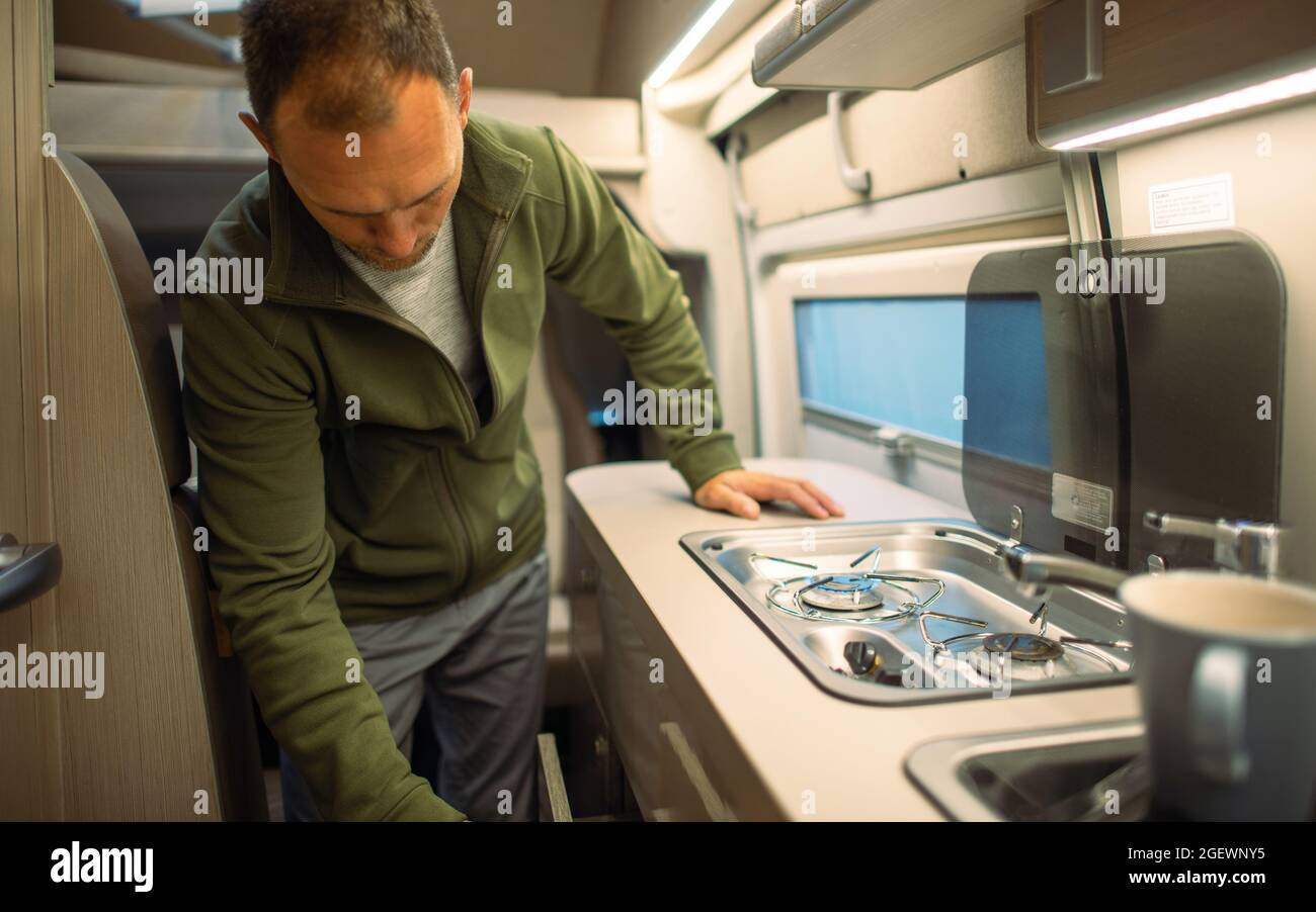 Road Trip and Van Life Theme. Caucasian Men in His 40s Preparing Camper ...
