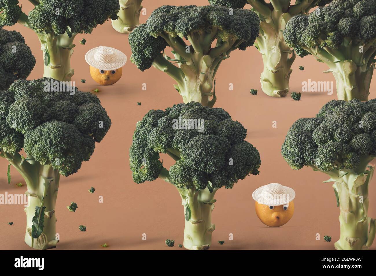 Broccoli and lemon on a brown background. Forest concept made of ...