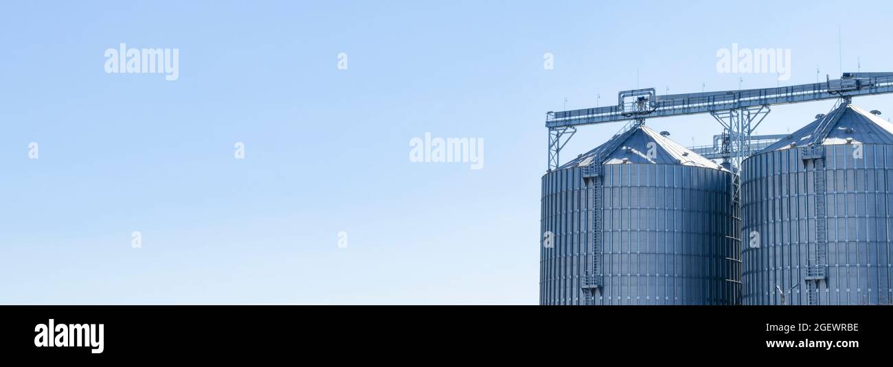 View of the modern outdoor grain storage silos. Background agriculture ...