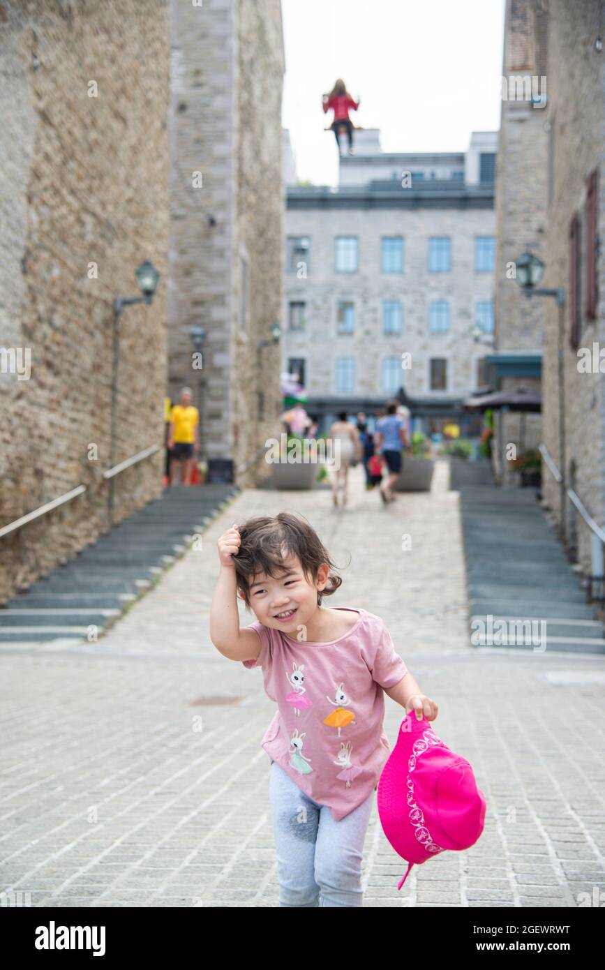 Quebec City, Canada - July 21 2021: Little baby girl with red hat ...