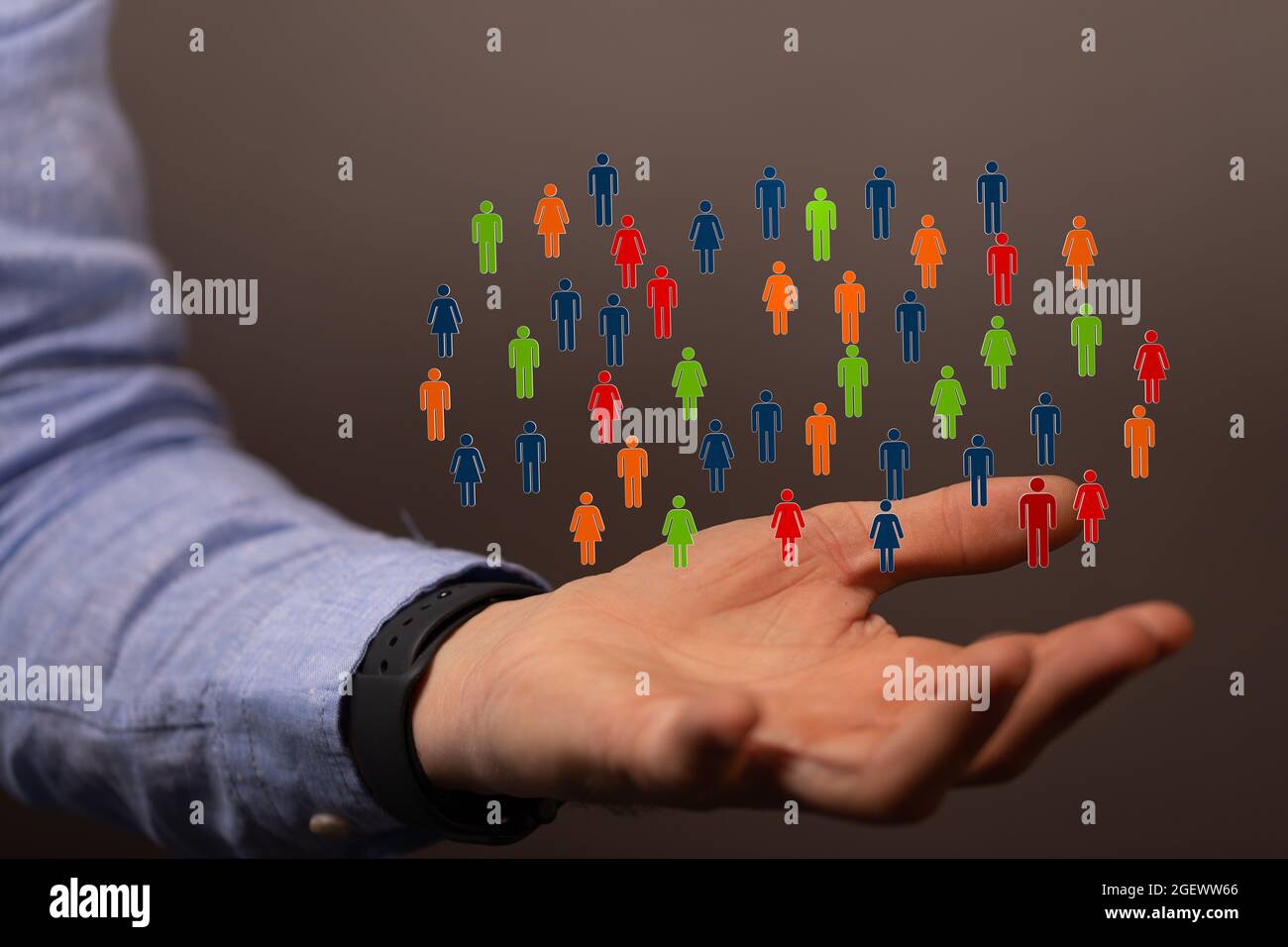 3D rendered people silhouettes held in a person's hand Stock Photo - Alamy