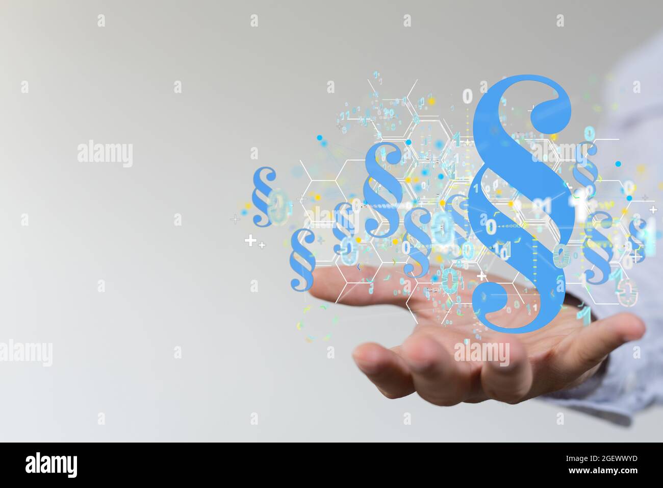 Digital concept of law and justice with floating law symbols on a hand ...