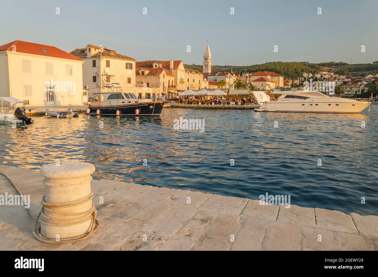 Picturesque old town of Supetar in sunset light. Supetar is the biggest ...