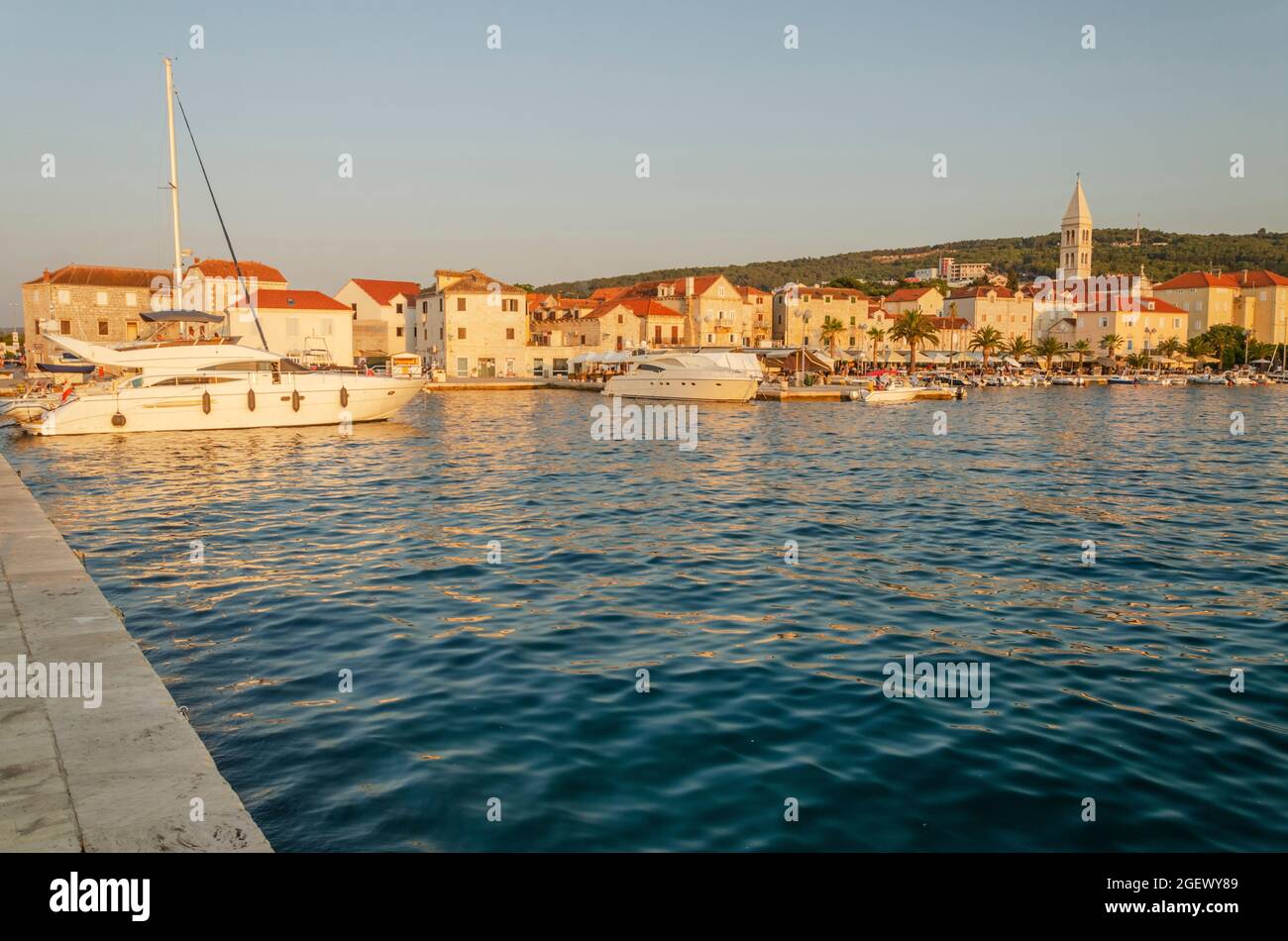 Picturesque old town of Supetar in sunset light. Supetar is the biggest ...