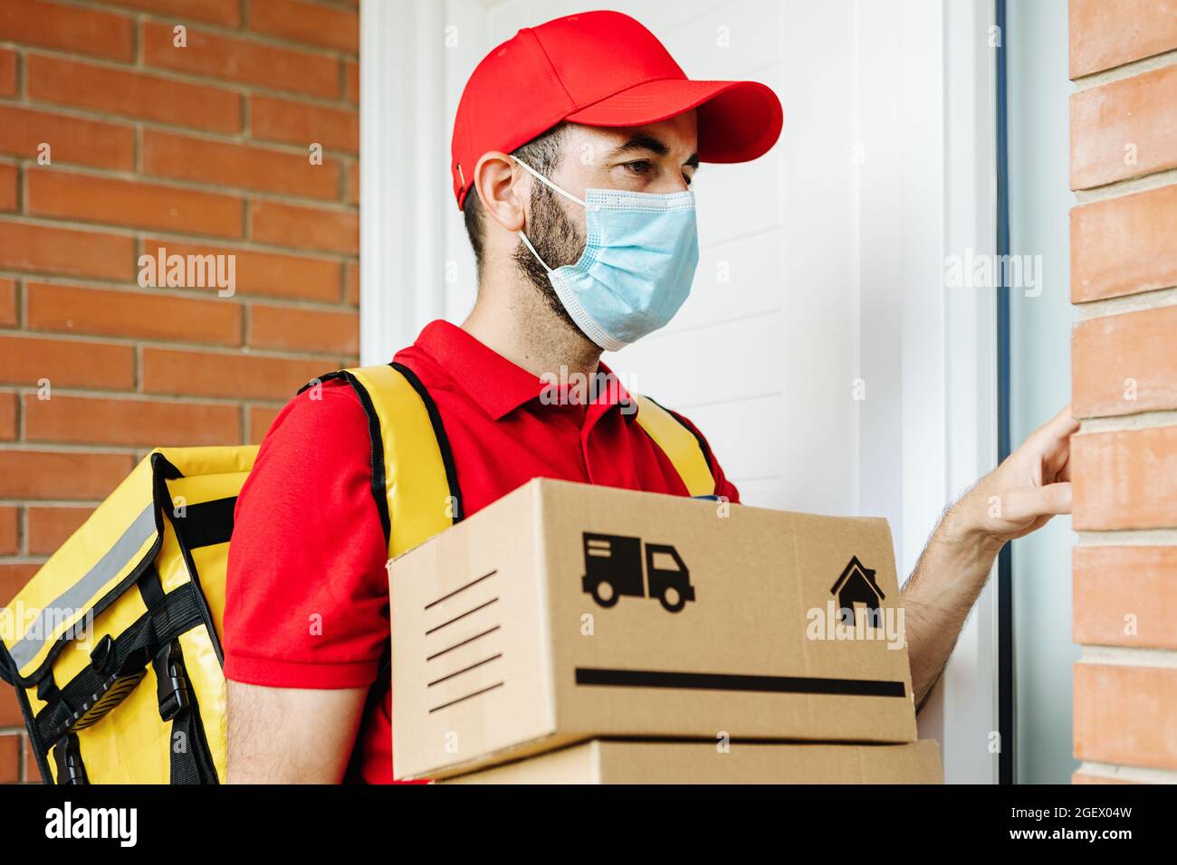 Delivery man mask package hi-res stock photography and images - Alamy